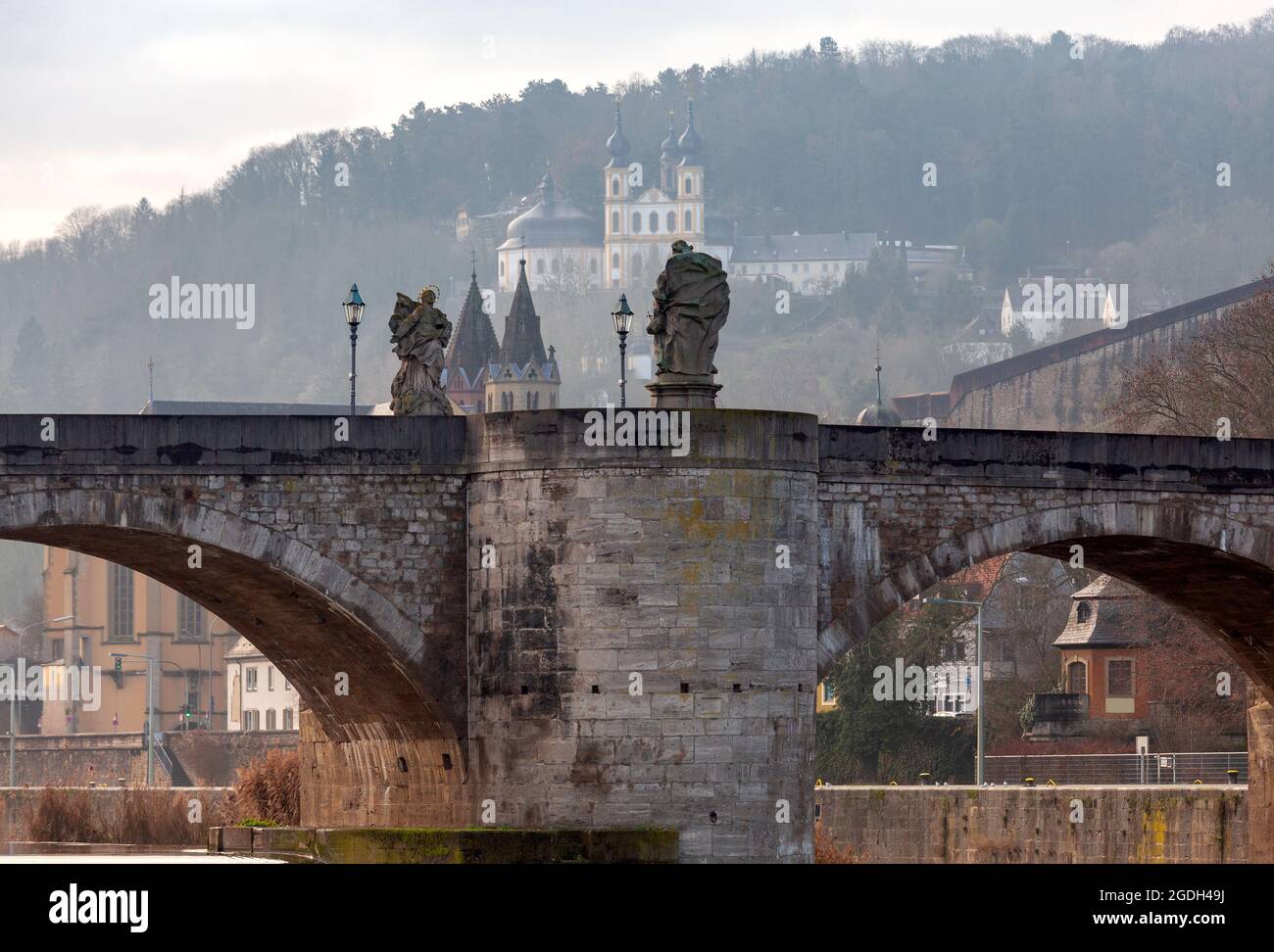 Old medieval stone bridge with sculptures in the early morning. Germany ...