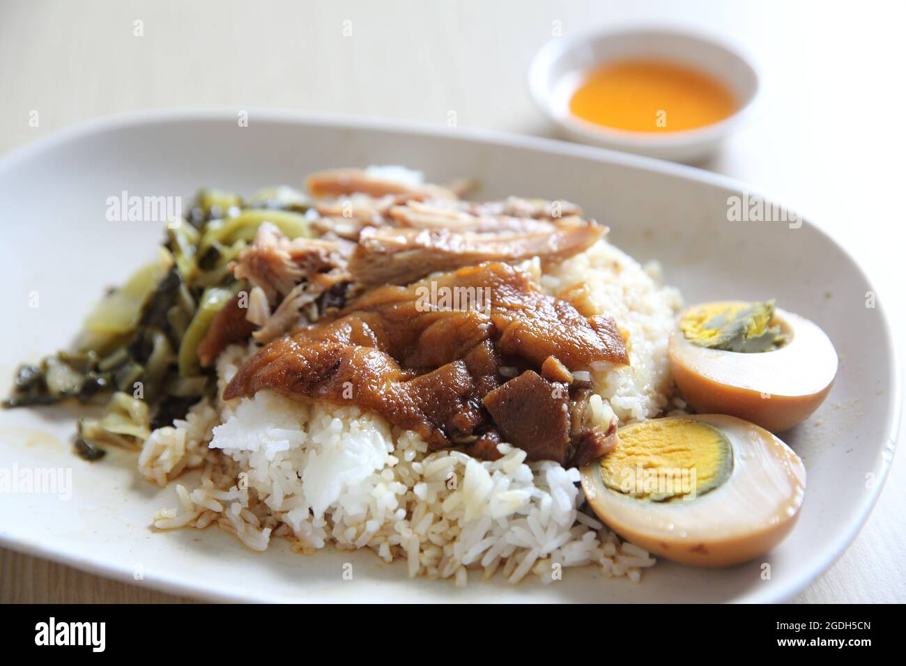 local thai food stewed pork leg on rice Stock Photo - Alamy