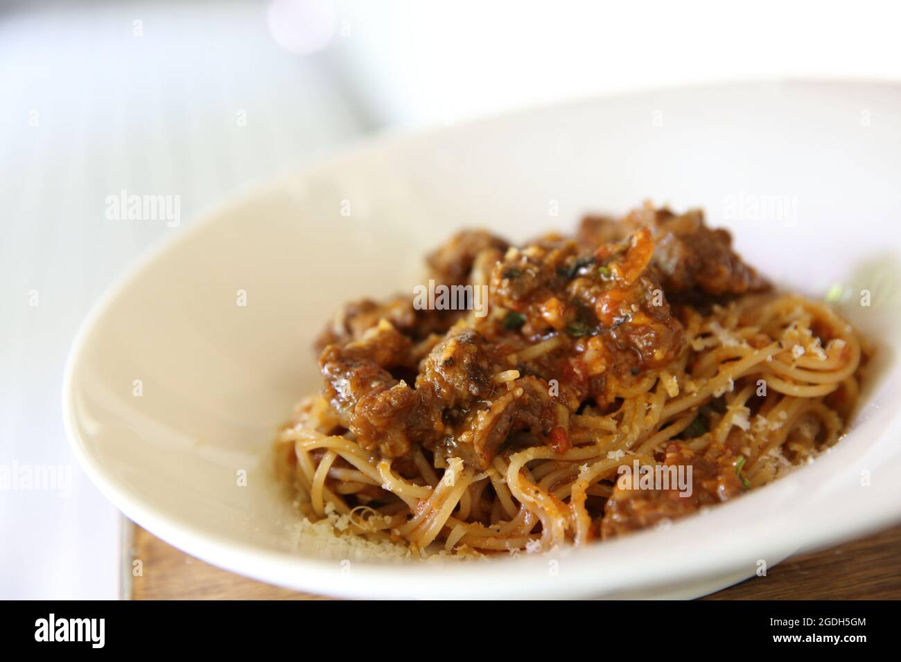 Beef stew spaghetti on wood background Stock Photo - Alamy