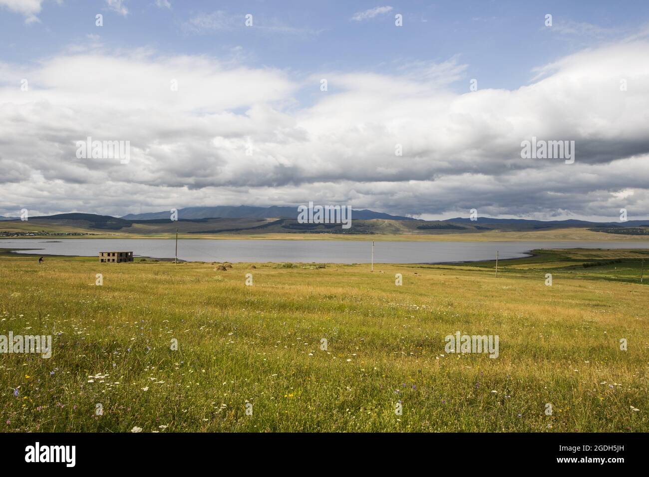 Landscape and view of lake in Tsalka, Georgia. Green field and clouds ...