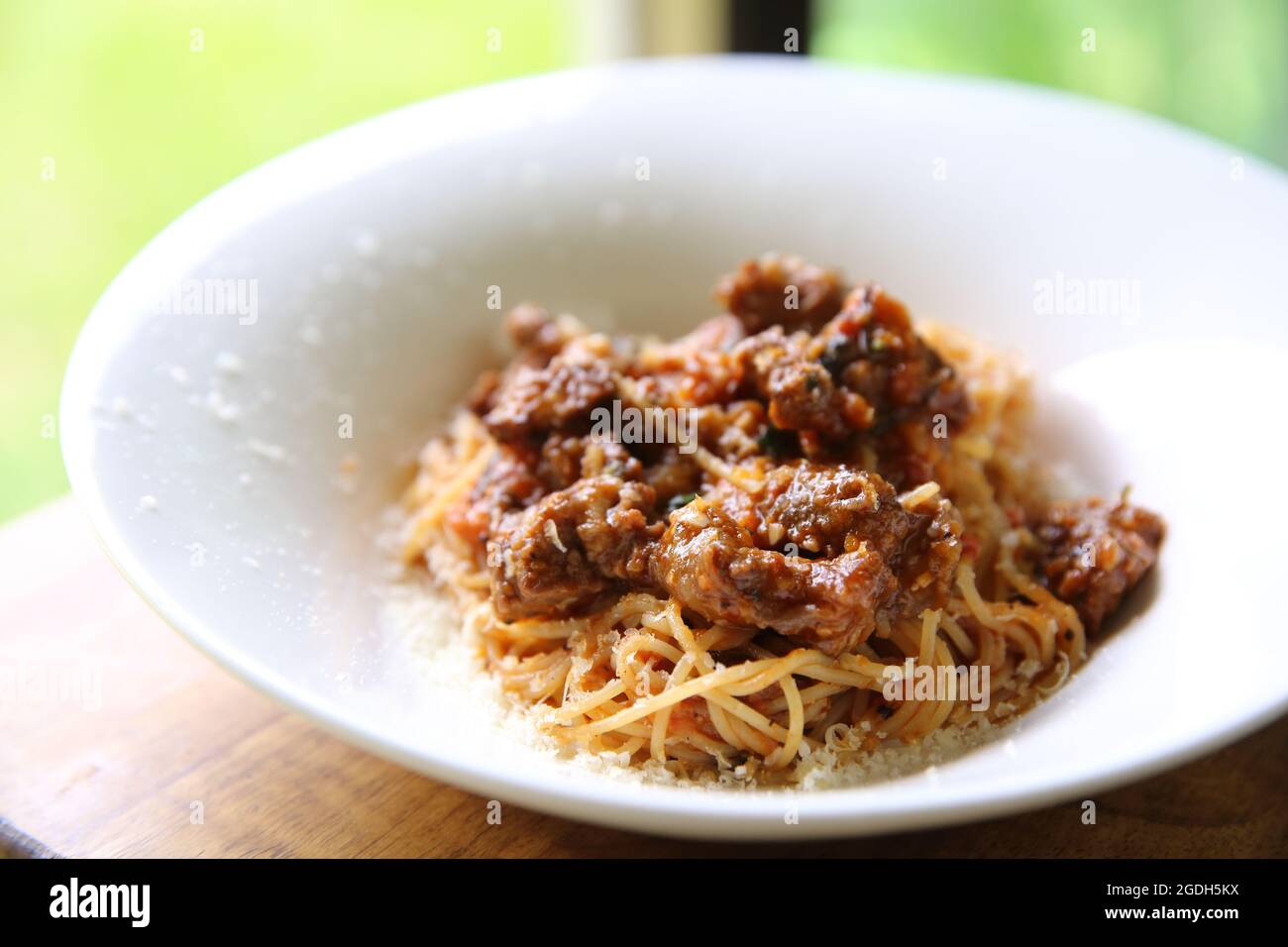 Beef stew spaghetti on wood background Stock Photo - Alamy