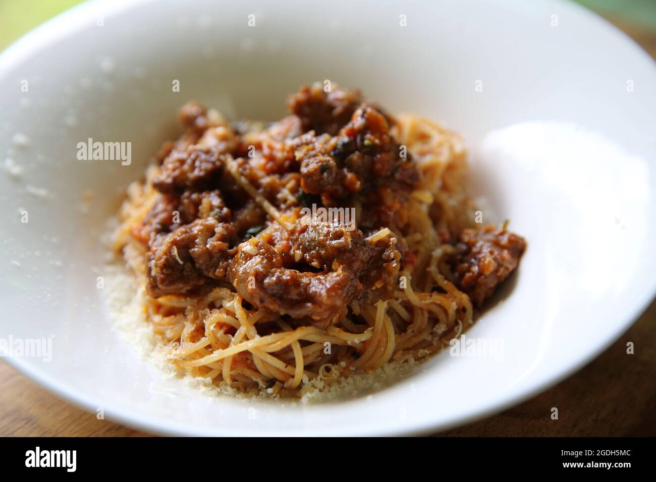 Beef stew spaghetti on wood background Stock Photo - Alamy