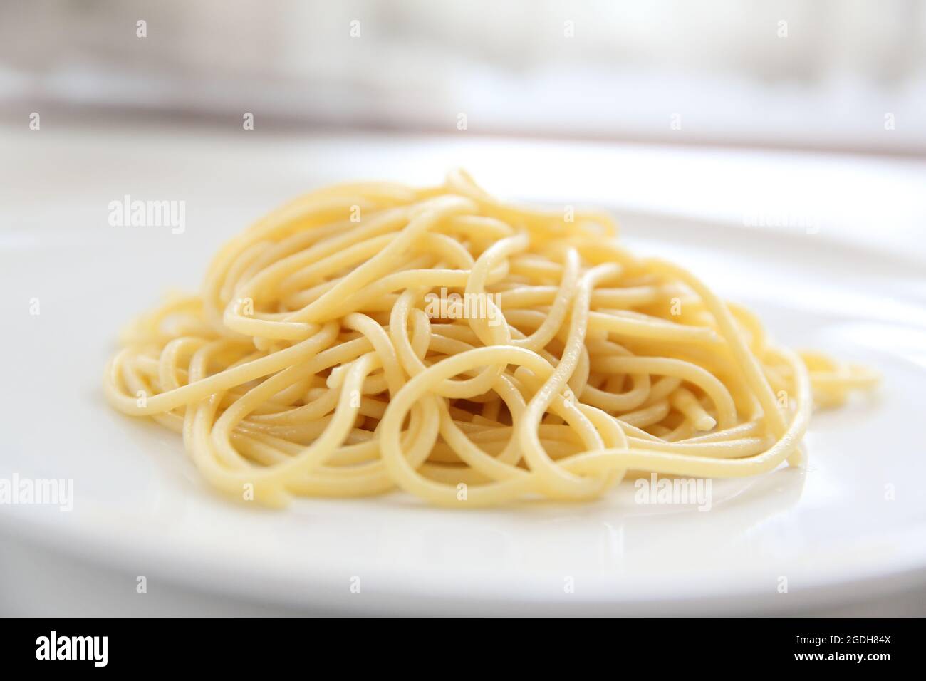 Spaghetti noodle isolated in white background Stock Photo - Alamy