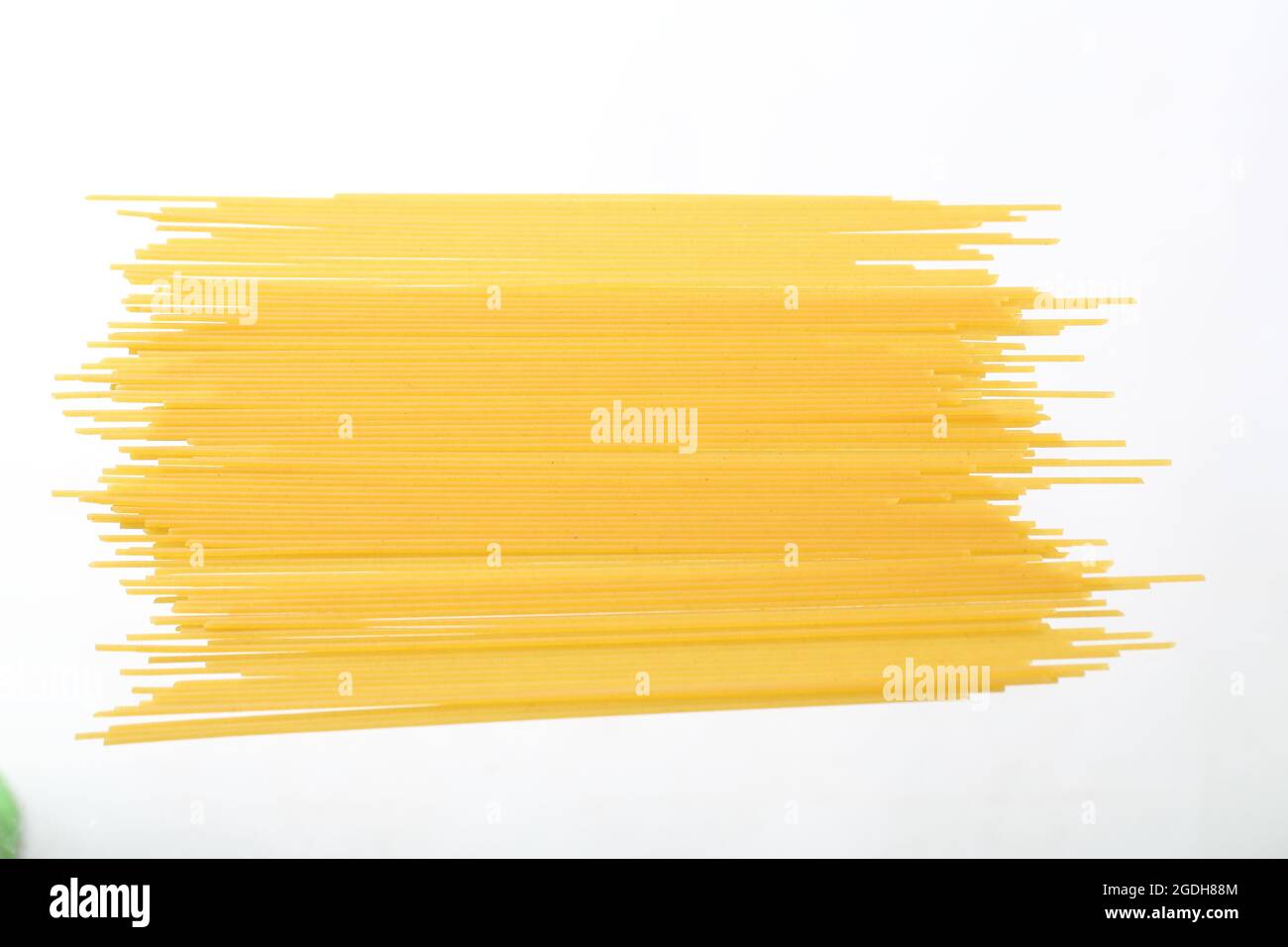 Raw spaghetti noodle isolated in white background Stock Photo - Alamy