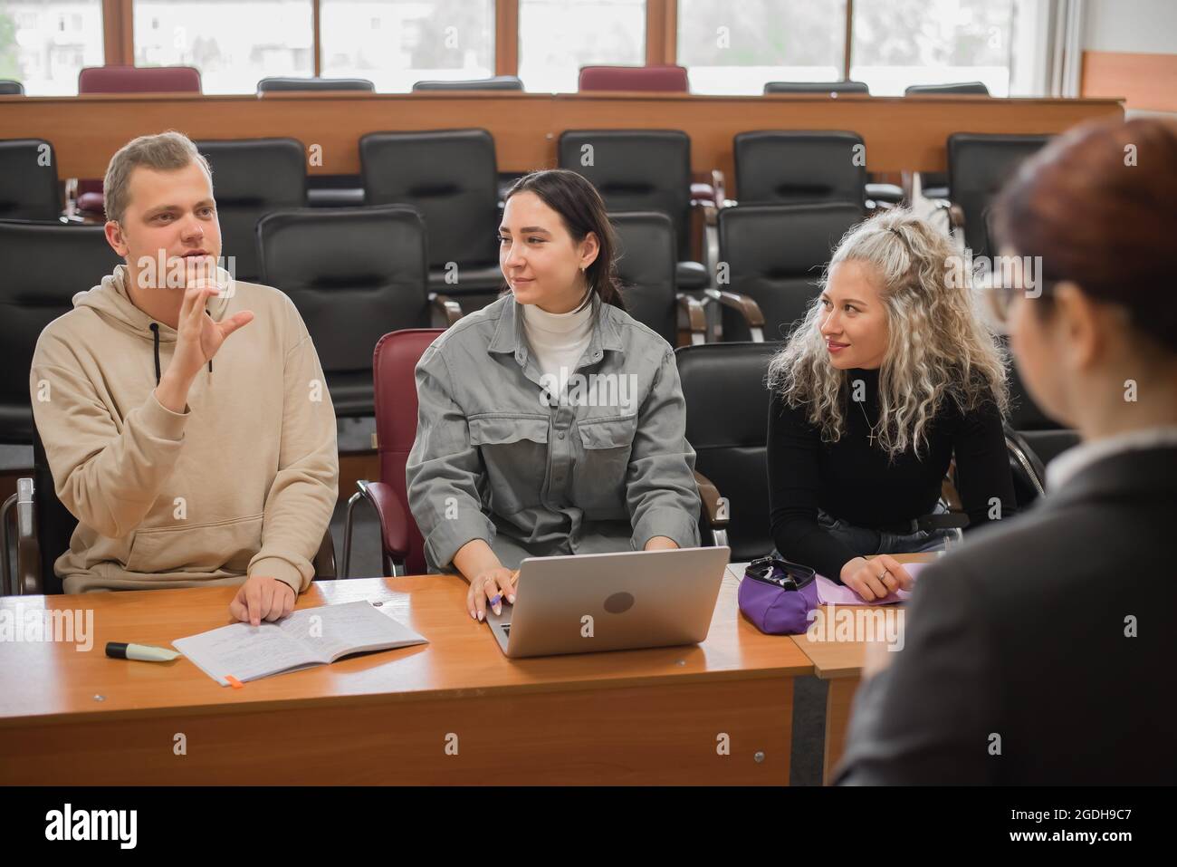 The teacher and students communicate in sign language in the classroom ...