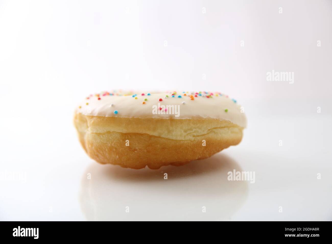White chocolate donut isolated in white background Stock Photo - Alamy