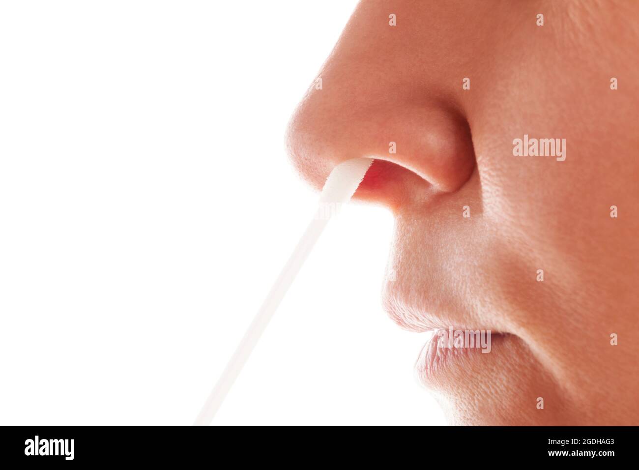 Beautiful woman getting a Covid 19 nasal swap test done. Close up of ...