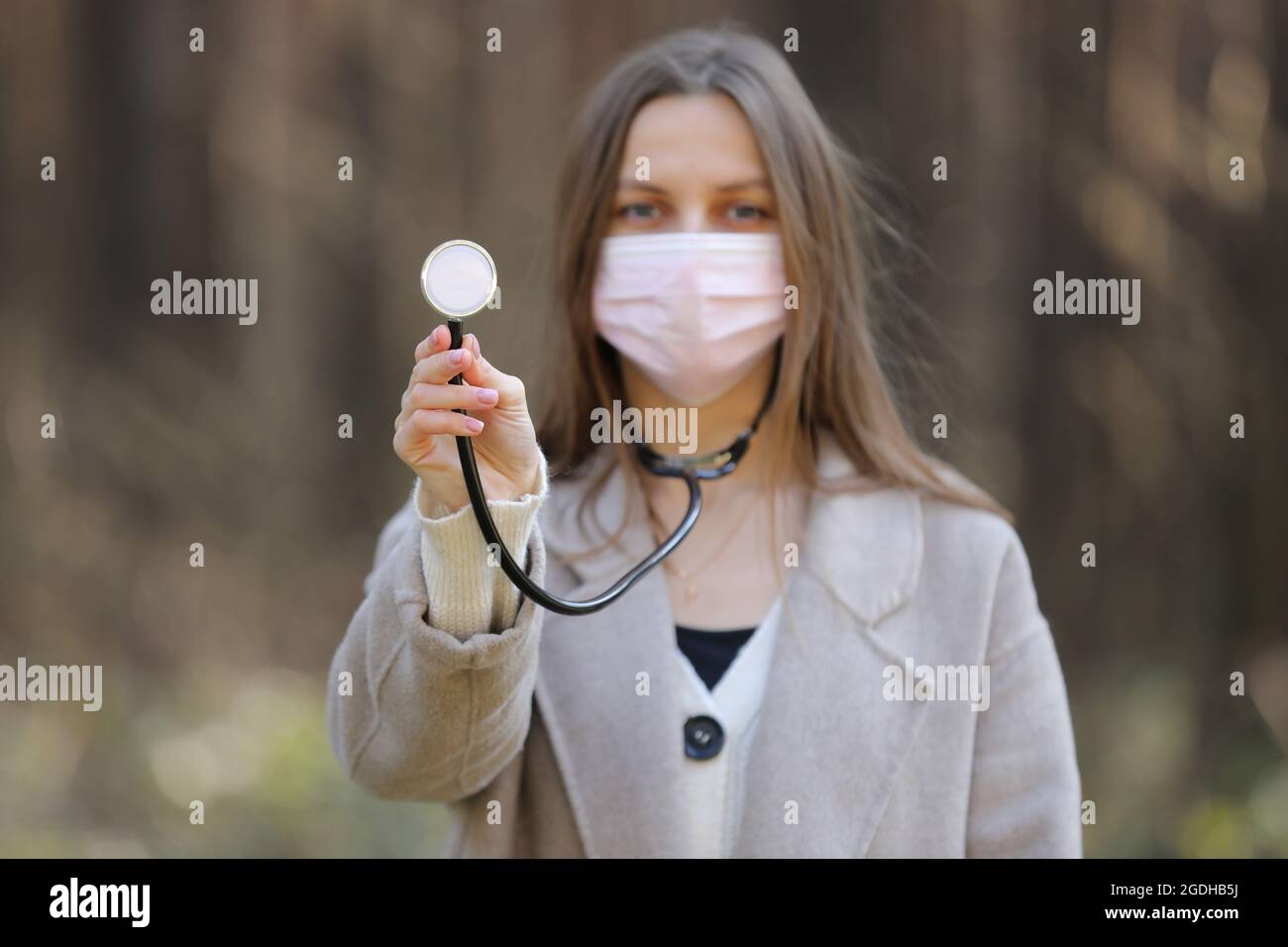 Woman face mask around her neck hi-res stock photography and images - Alamy