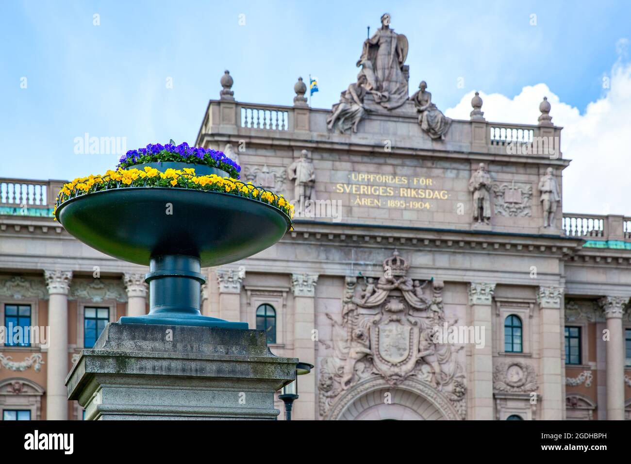 Flowers with colors of swedish flag in front of the Parliament of ...
