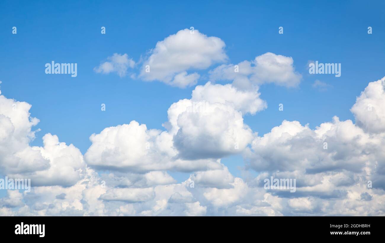 Blue sky with cumulus clouds at daytime Stock Photo - Alamy