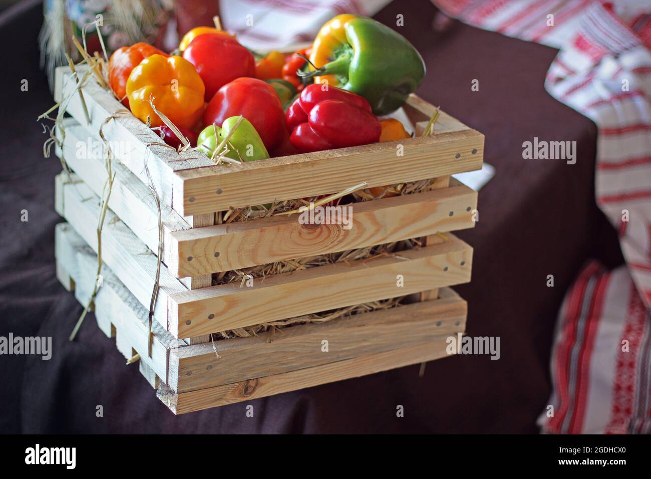 Colored bell pepper in a box. Pepper harvest Stock Photo - Alamy