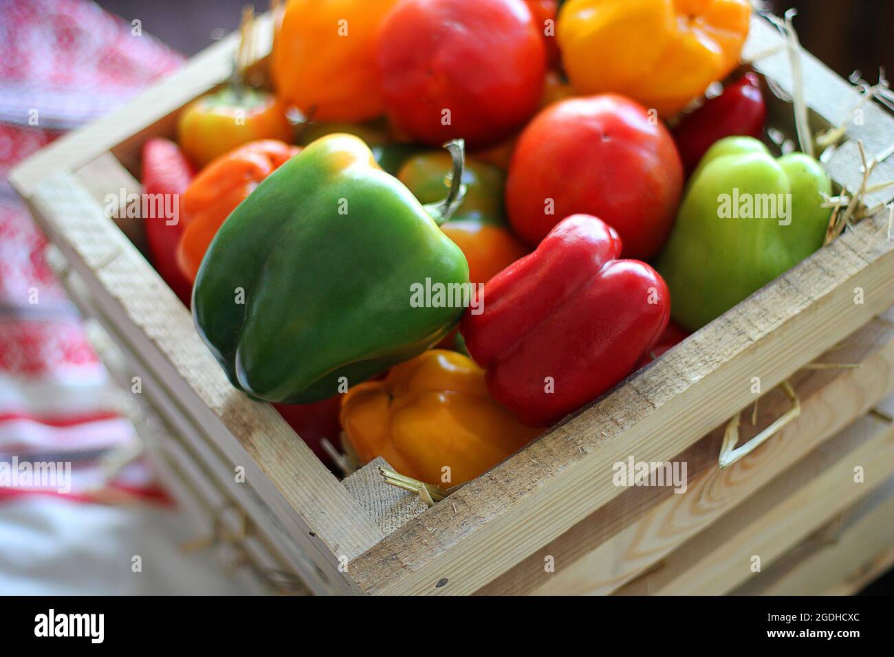 Colored bell pepper in a box. Pepper harvest Stock Photo - Alamy