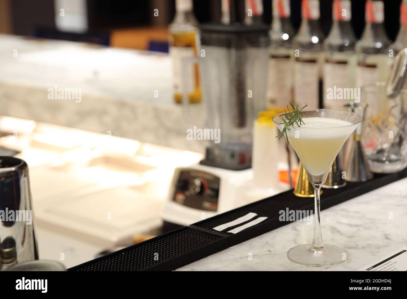 White cocktail in bar background Stock Photo - Alamy