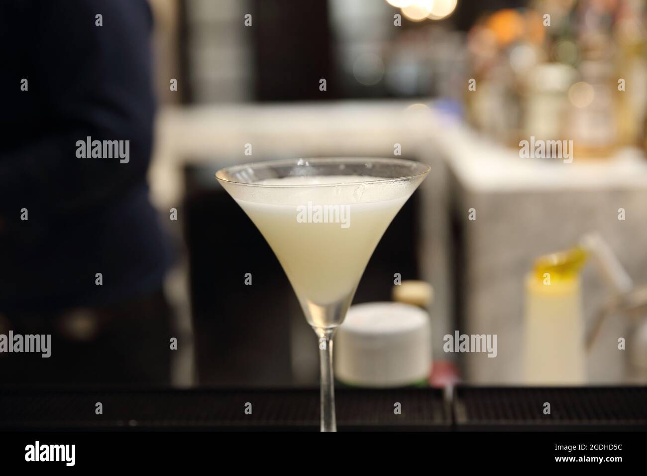 White cocktail in bar background Stock Photo - Alamy