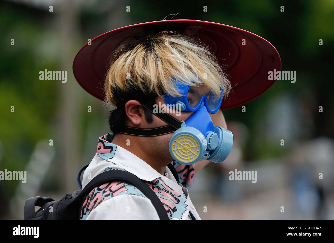 Bangkok, Thailand. 13th Aug, 2021. A protester wearing a gas mask ...