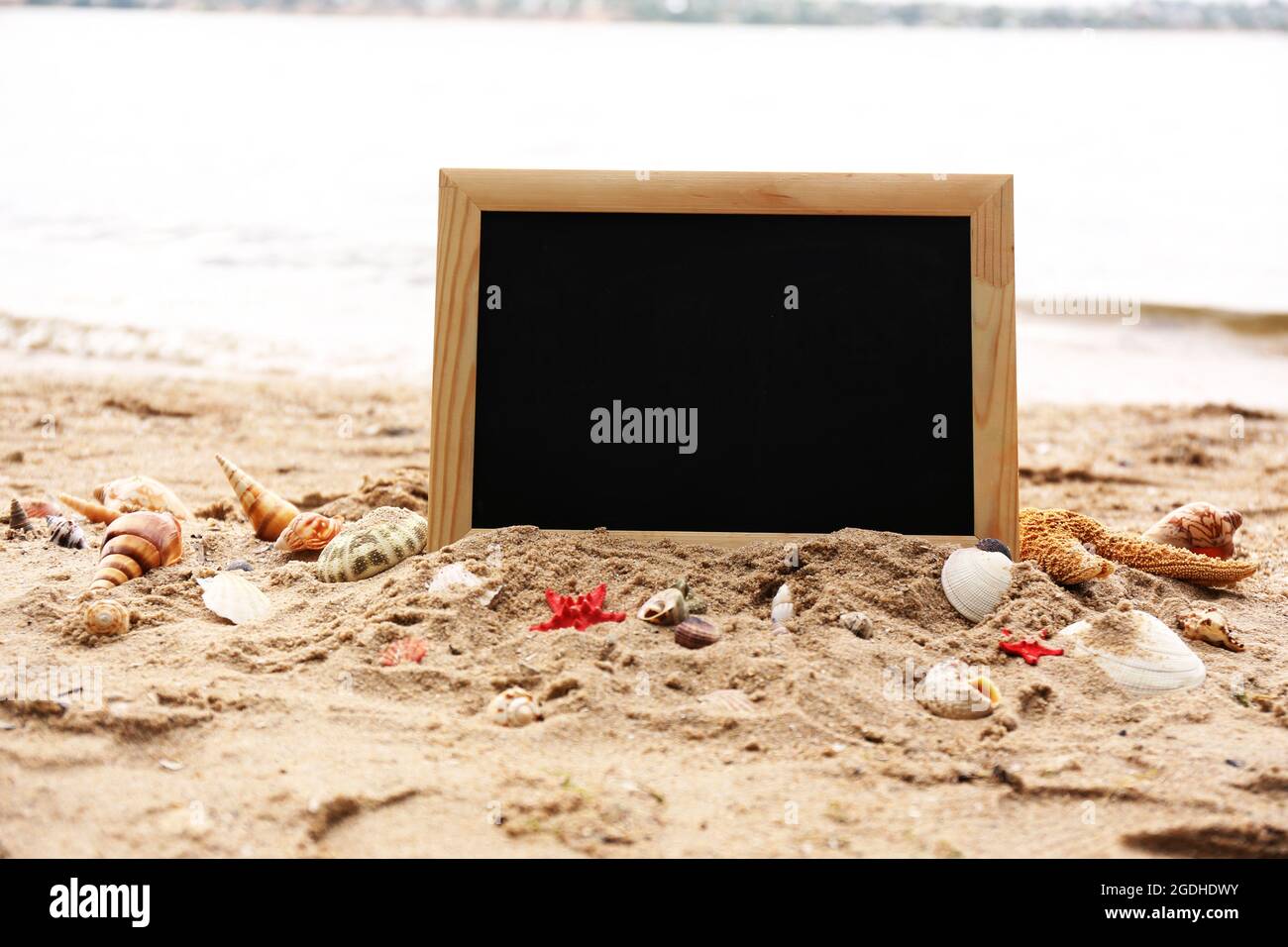 Blank chalkboard on beach background Stock Photo - Alamy