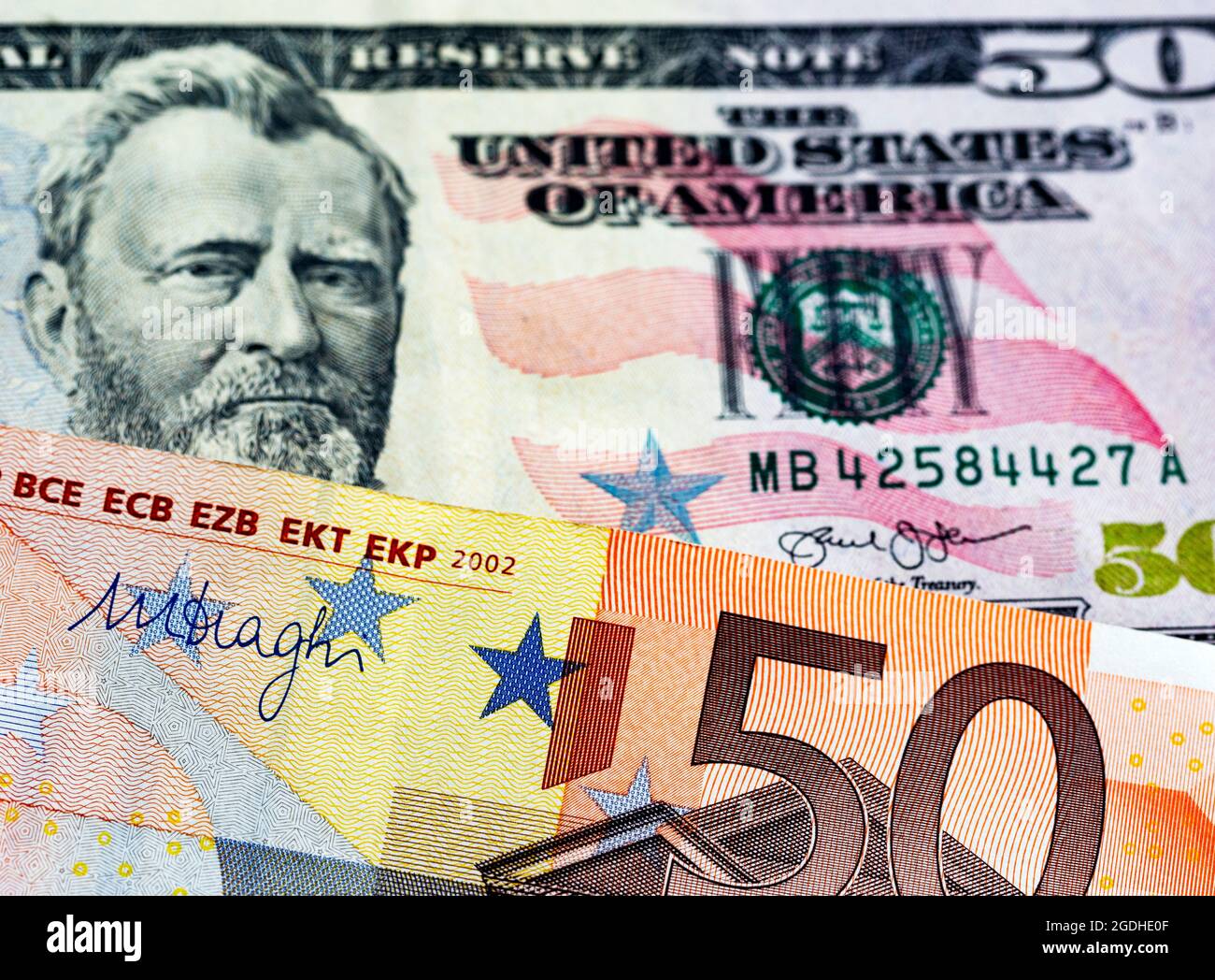 In this photo illustration, United States fifty-dollar and fifty euro ...