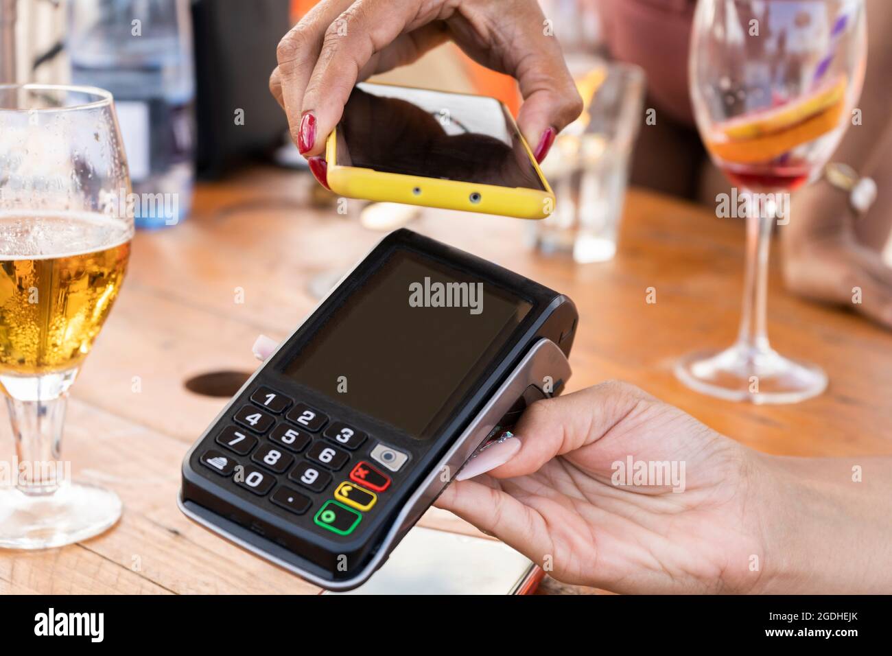 Contactless Nfc payment with phone concept.Woman hand holding ... Contactless Nfc payment with phone concept.Woman hand holding ...