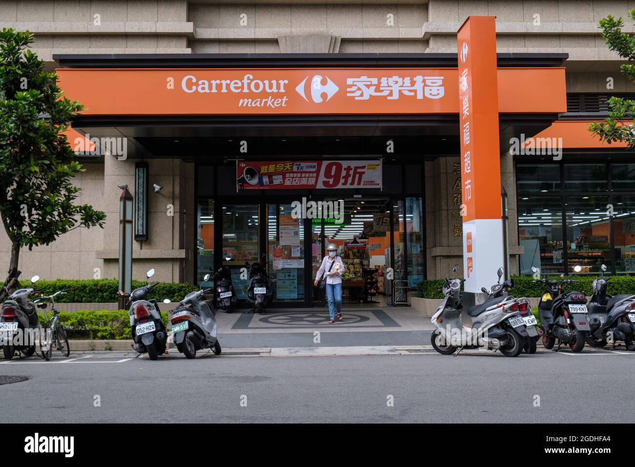 New Taipei City, Taiwan. 13th Aug, 2021. A person seen leaving a ...