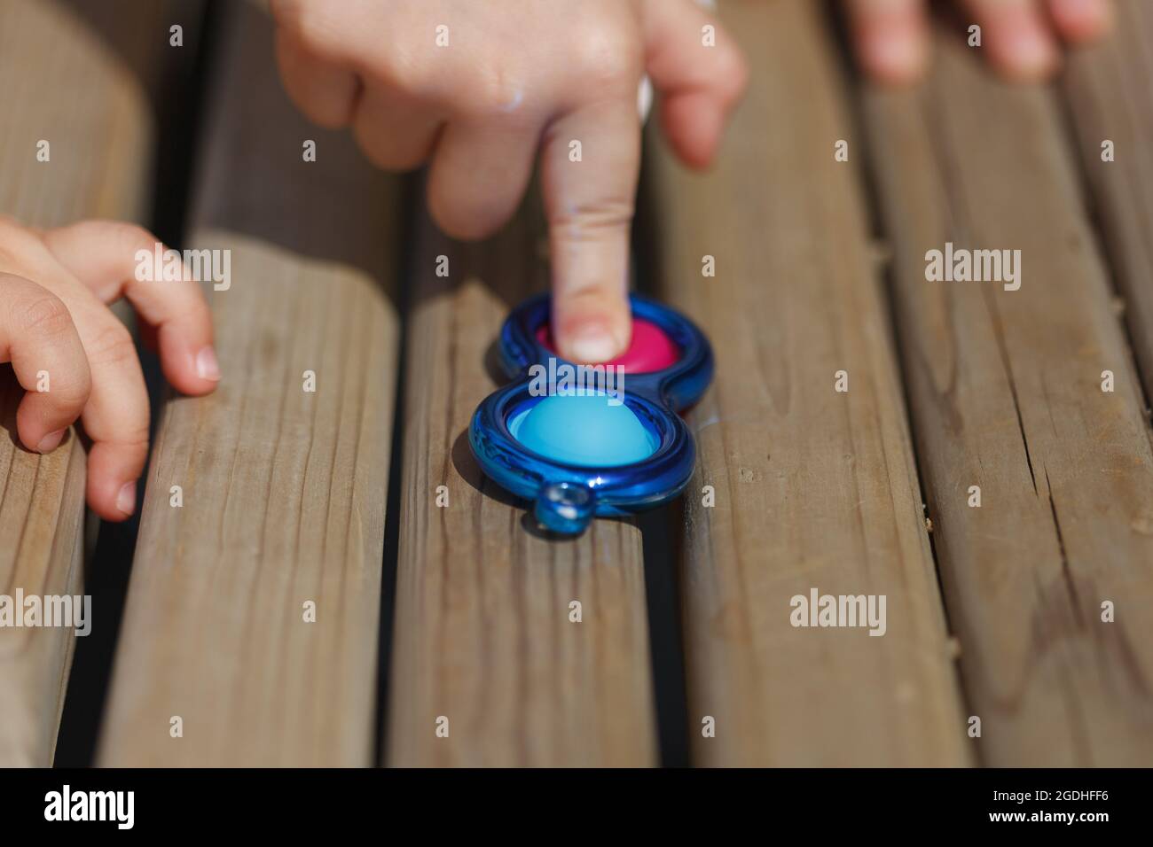 Child's hand pressing simple-dimple, Closeup Stock Photo - Alamy