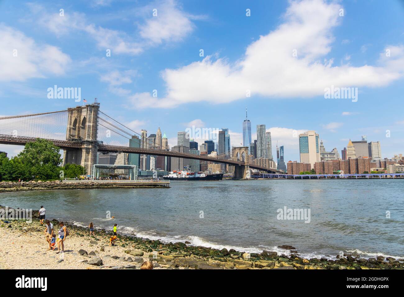 People enjoy time with friends on the Beach of Brooklyn Bridge Park ...