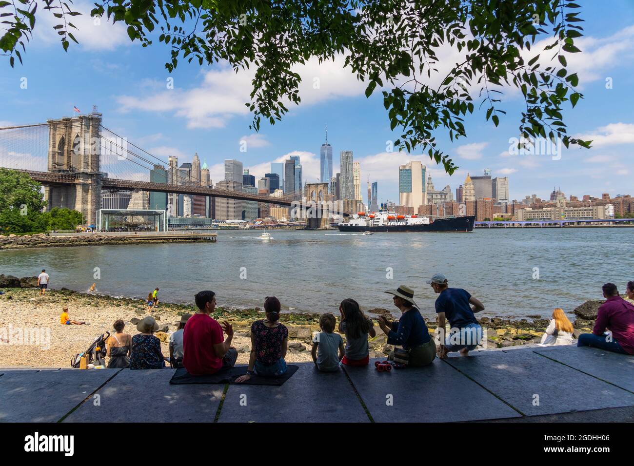 People enjoy time with friends on the Beach of Brooklyn Bridge Park ...