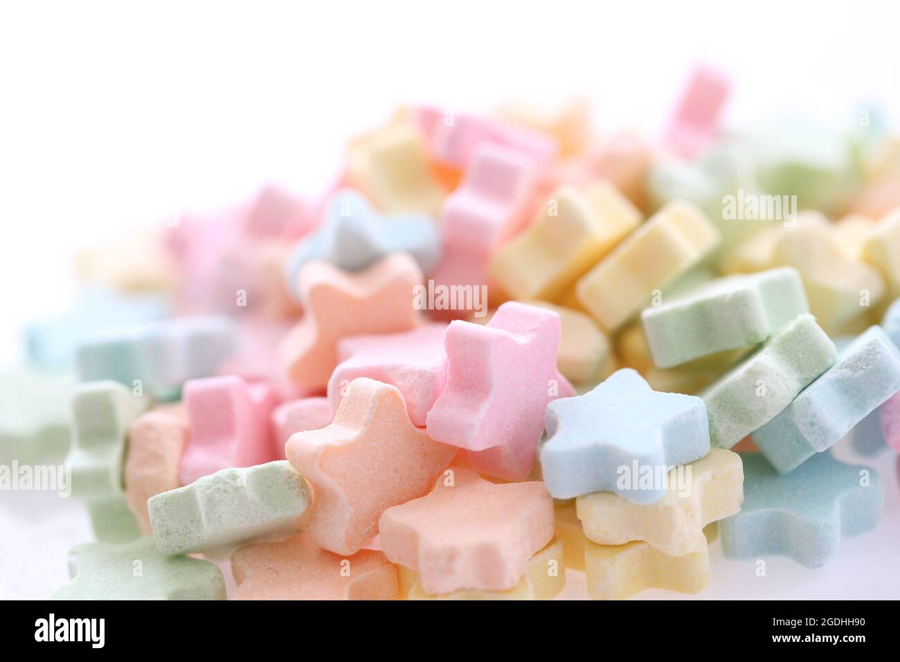 Colourful Star Milk pellets isolated in white background Stock Photo ...