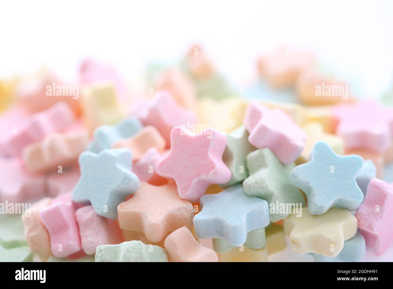 Colourful Star Milk pellets isolated in white background Stock Photo ...