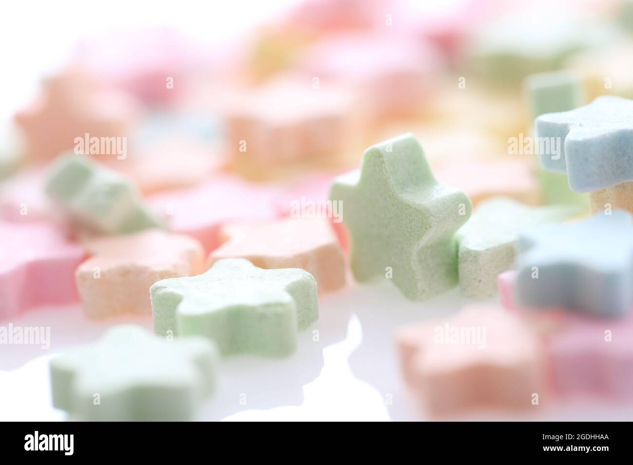 Colourful Star Milk pellets isolated in white background Stock Photo ...