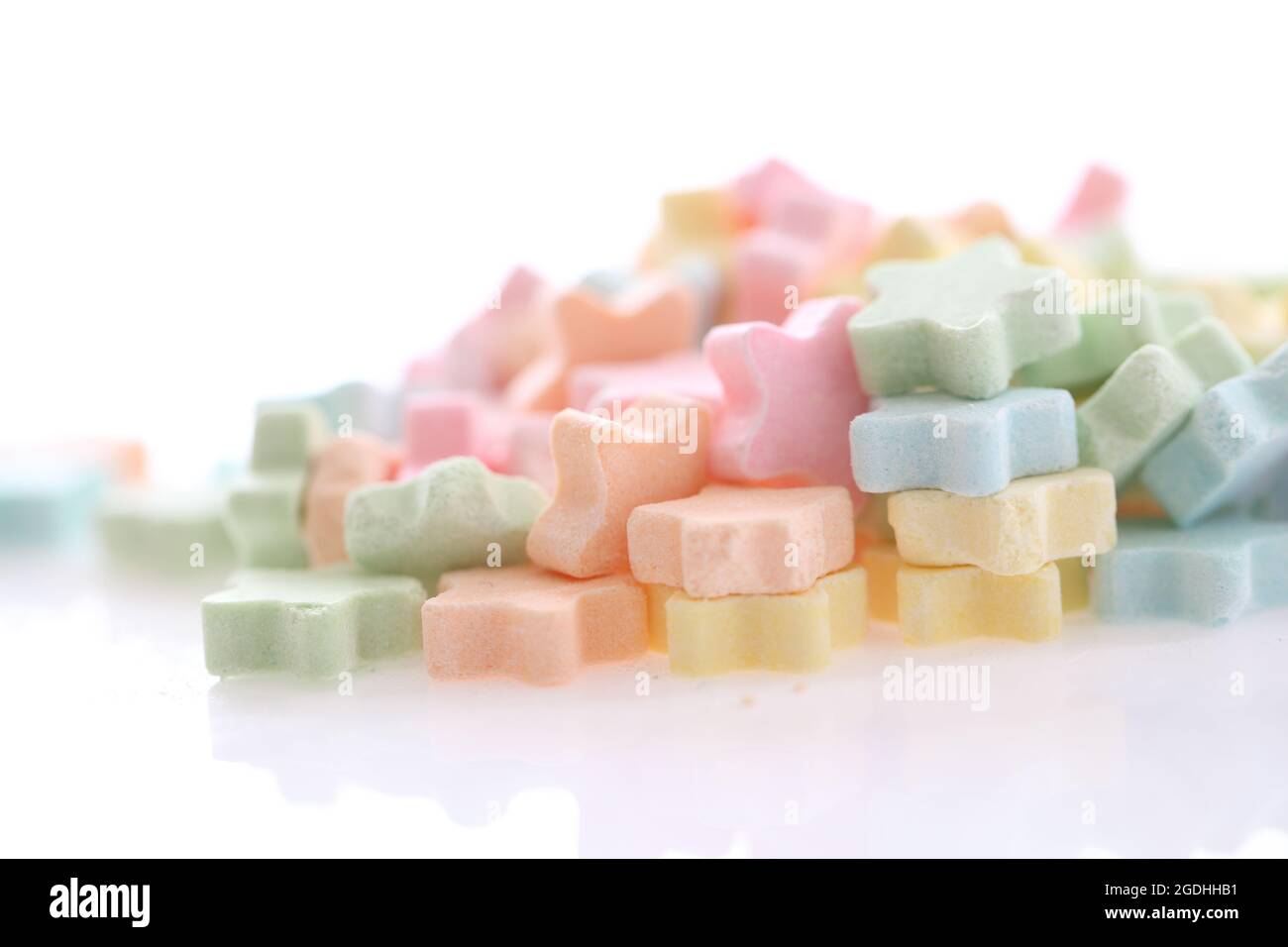 Colourful Star Milk pellets isolated in white background Stock Photo ...
