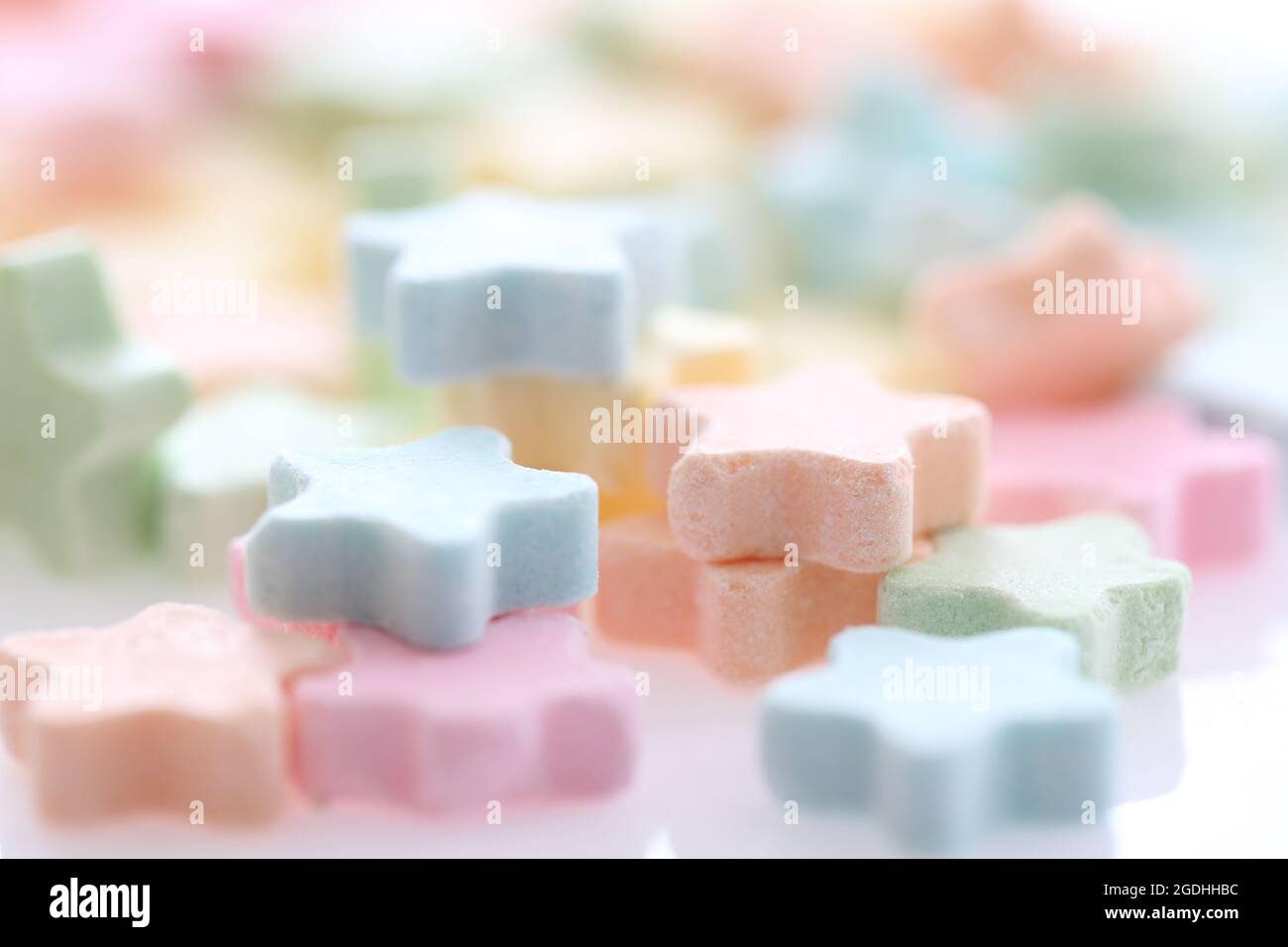 Colourful Star Milk pellets isolated in white background Stock Photo ...