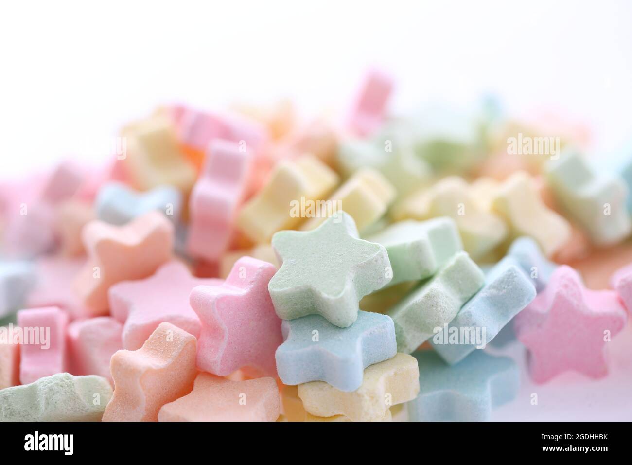 Colourful Star Milk pellets isolated in white background Stock Photo ...