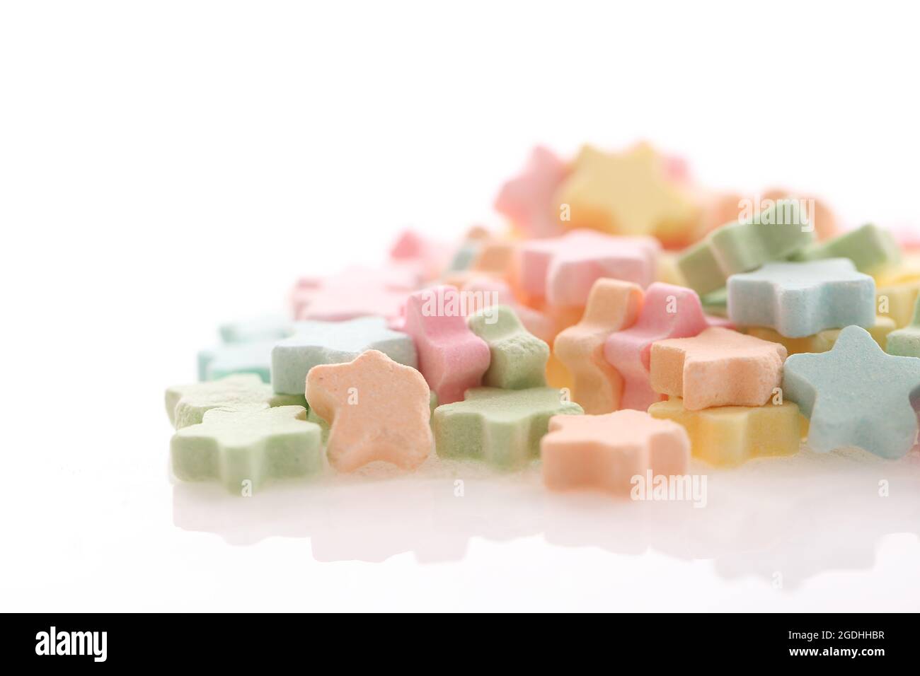 Colourful Star Milk pellets isolated in white background Stock Photo ...