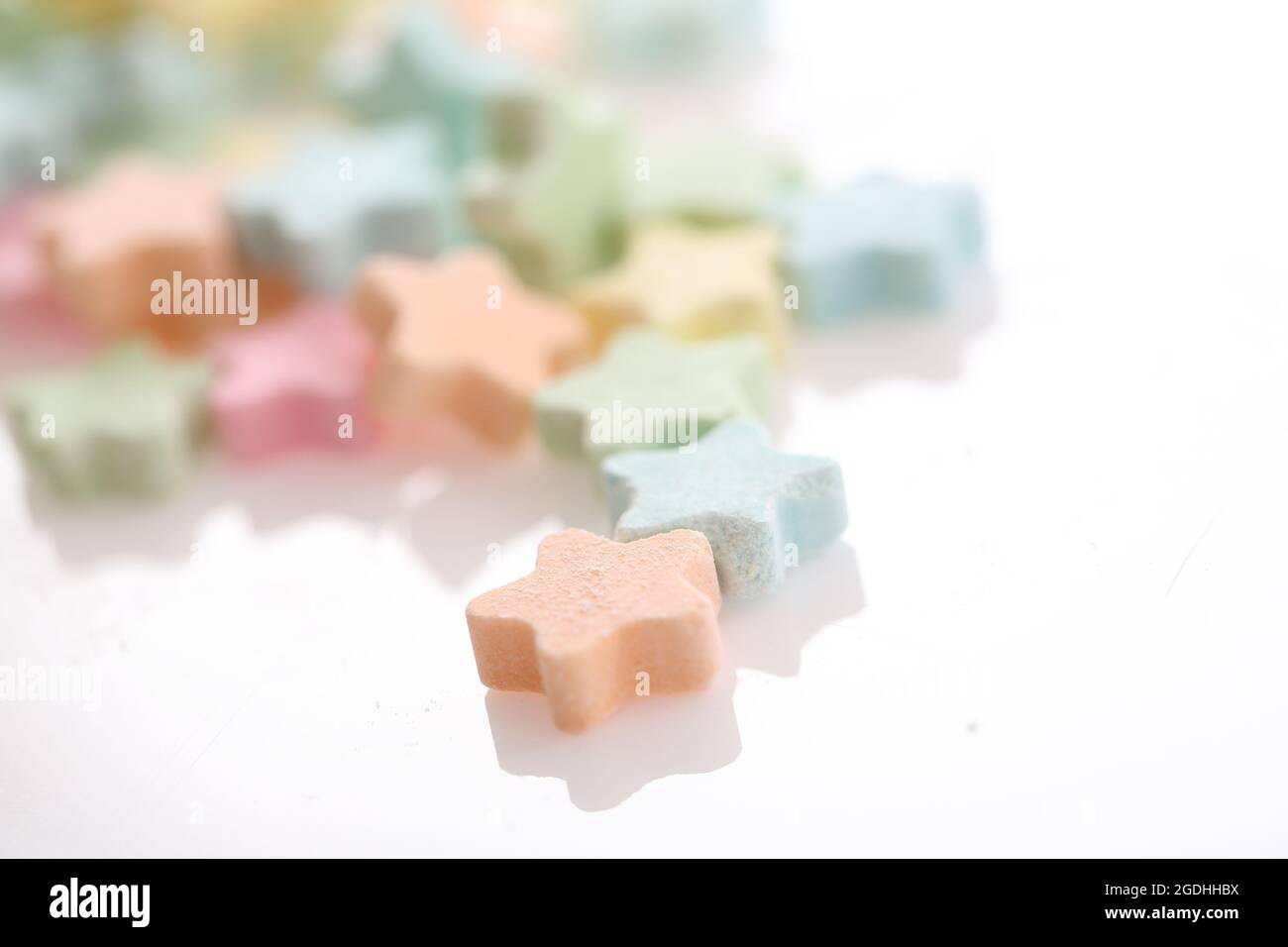 Colourful Star Milk pellets isolated in white background Stock Photo ...