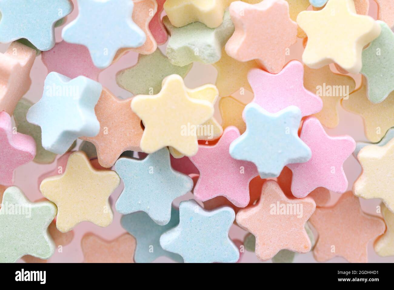 Colourful Star Milk pellets isolated in white background Stock Photo ...