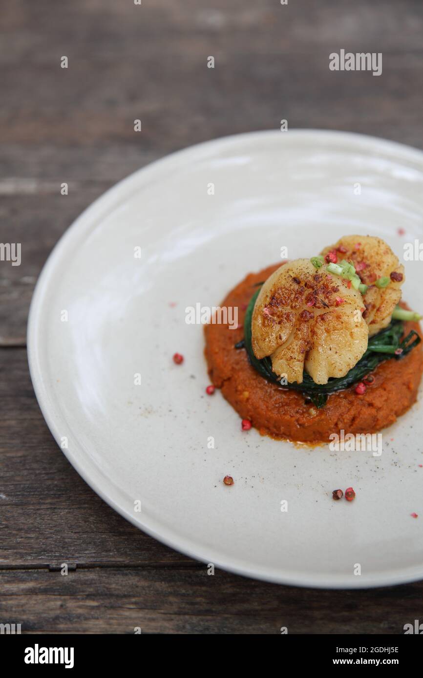 Seared scallops , Grilled scallop with pasley starter food on wood ...