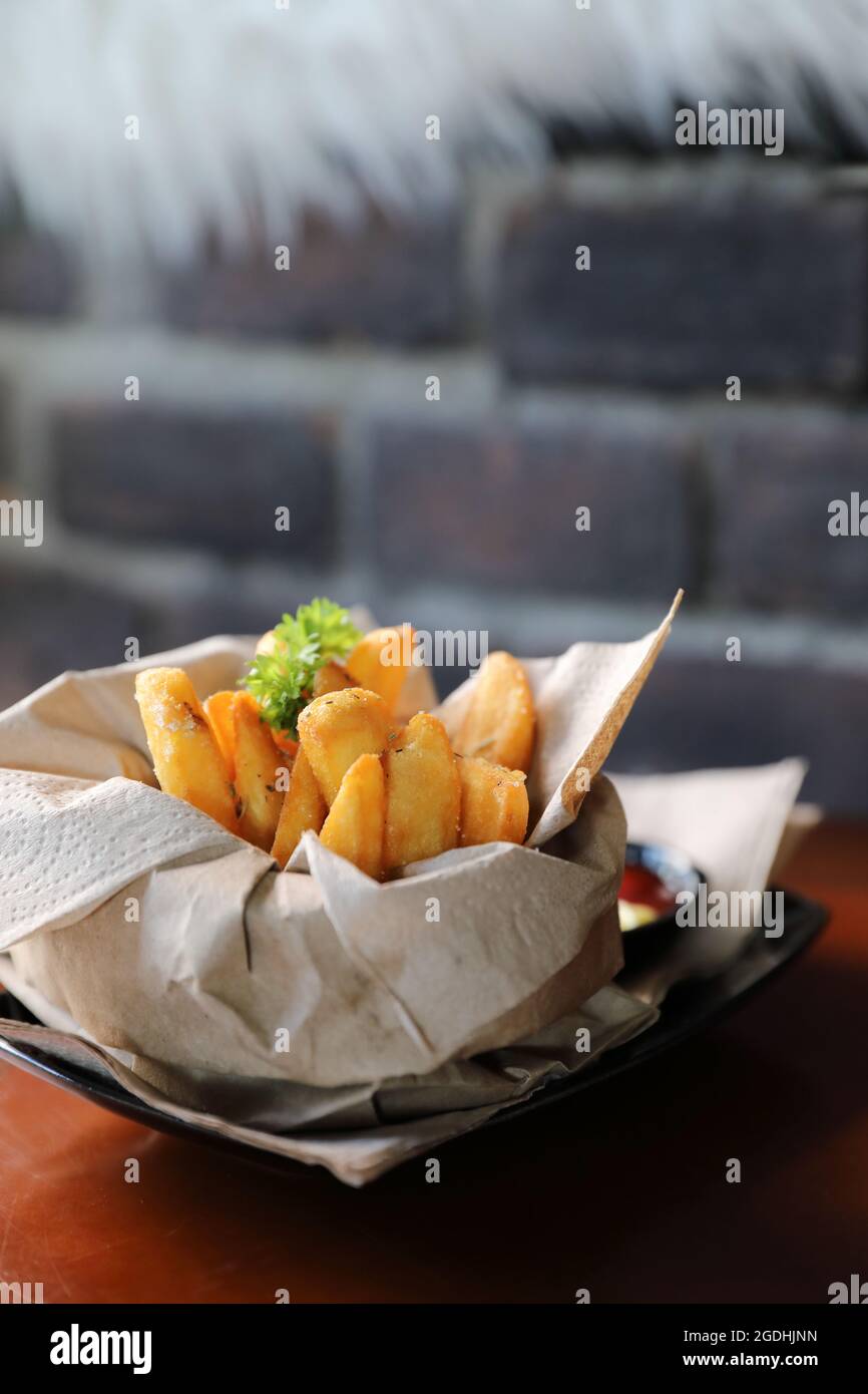 French fries in vintage style on wood background Stock Photo - Alamy