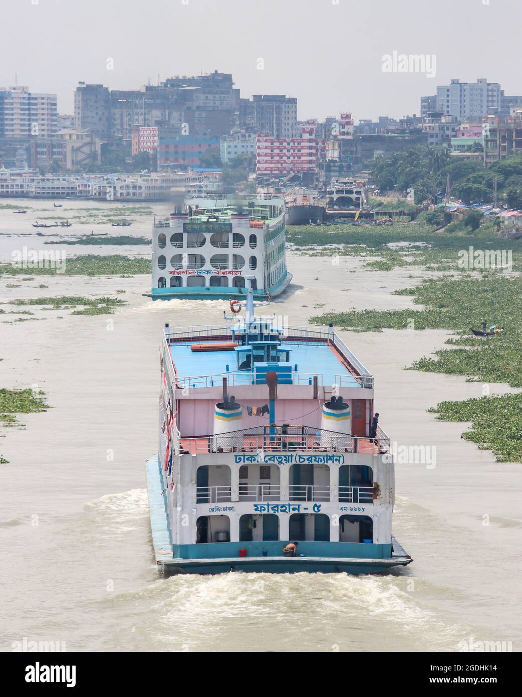 Local Passenger ferry returning to Dhaka river port. Ferry is a very ...