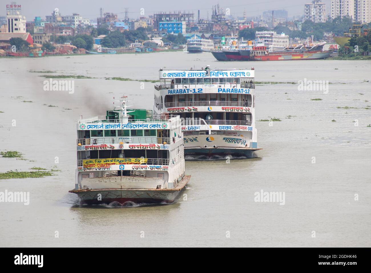Local Passenger ferry returning to Dhaka river port. Ferry is a very ...