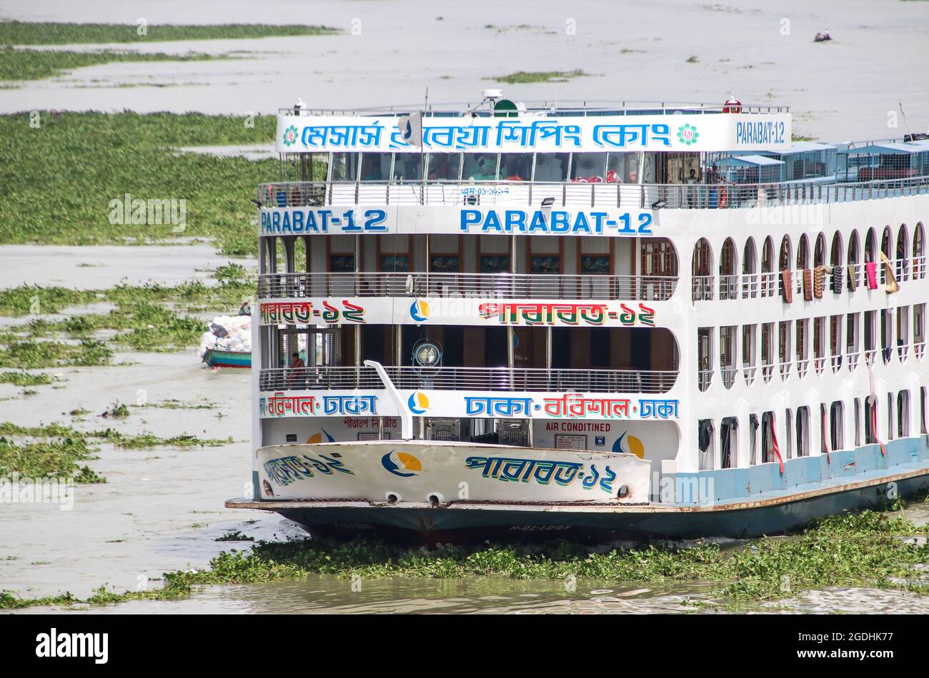 Local Passenger ferry returning to Dhaka river port. Ferry is a very ...