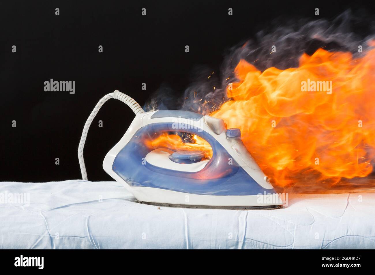 On the ironing board fire caused by faulty electrical wiring Stock ...