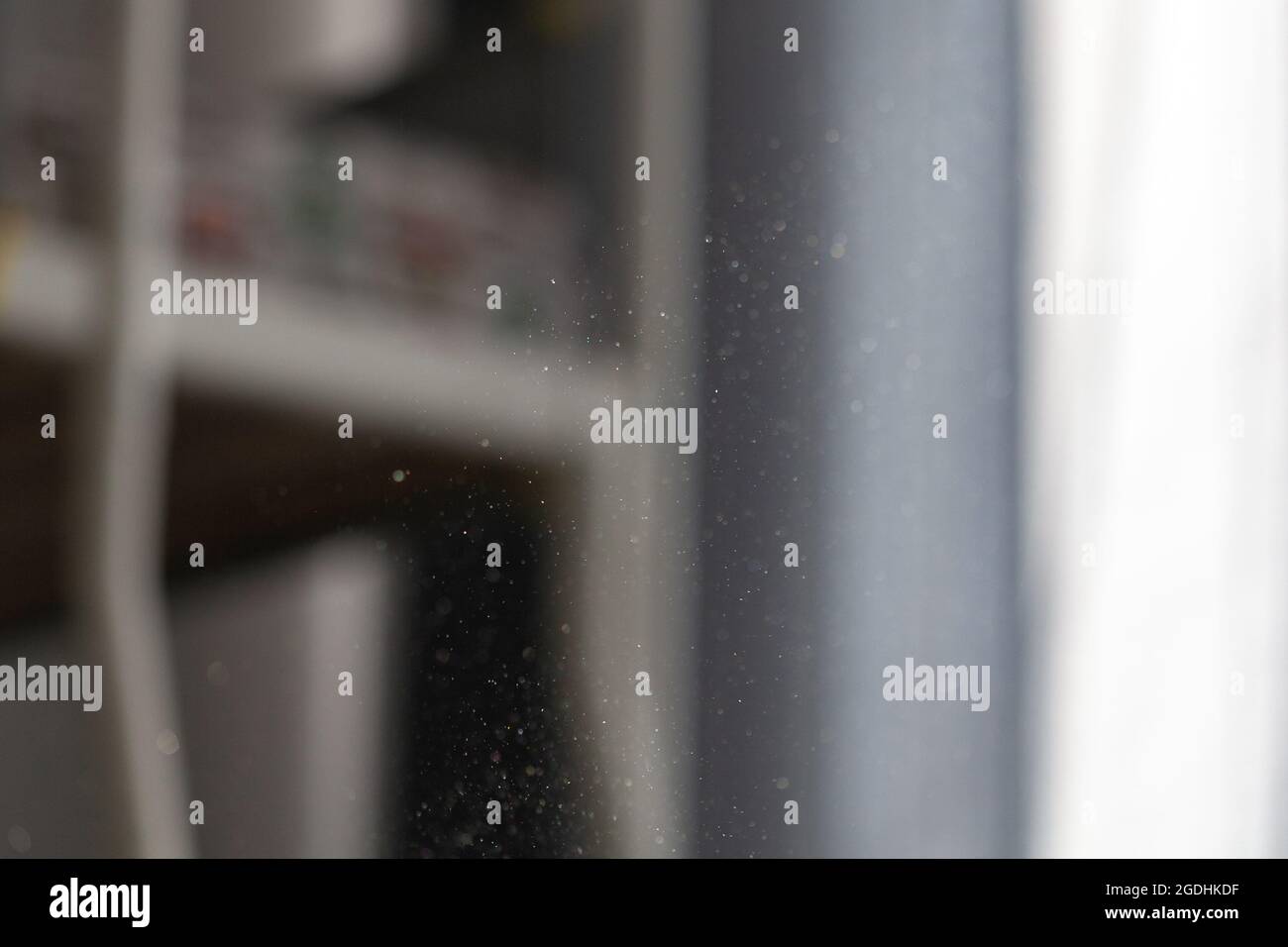 Dust in the room, in the sunlight from the window selective focus ...