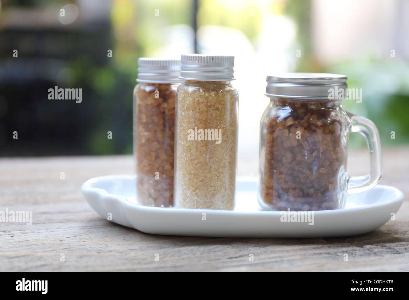Sugar on wood background Stock Photo - Alamy