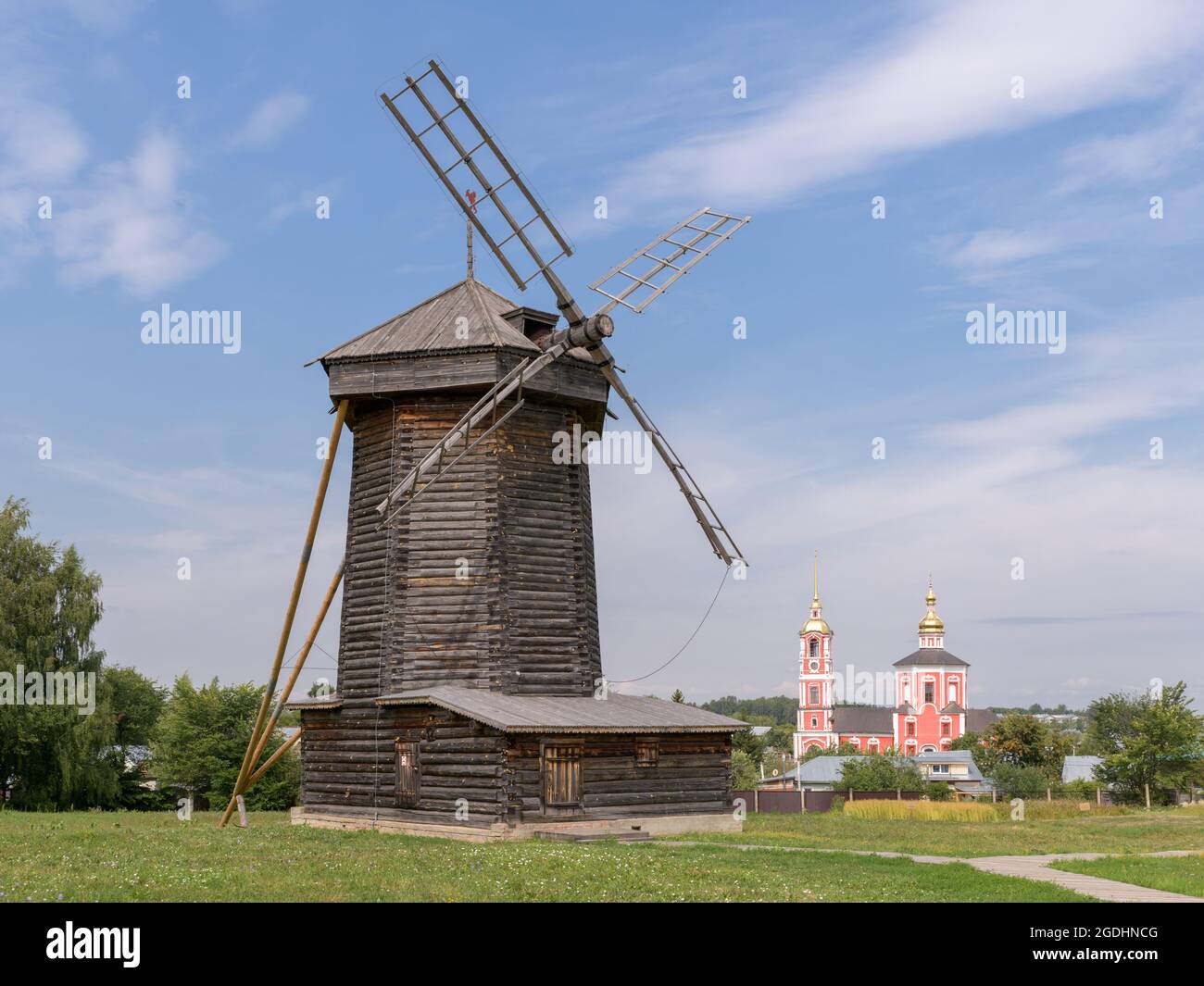 Traditional russian view. Wooden windmill and church. Suzdal, Russia ...