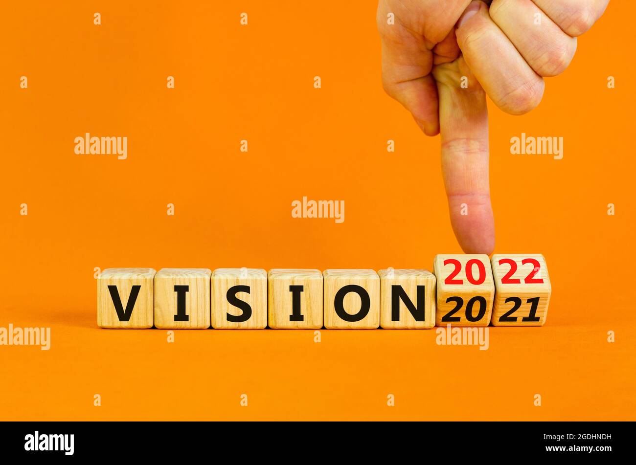 2022 vision new year symbol. Businessman turns wooden cubes and changes ...