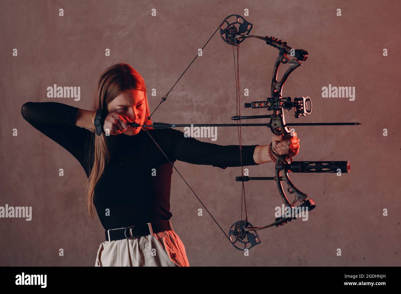 Archer woman with sport bow and arrow Stock Photo - Alamy