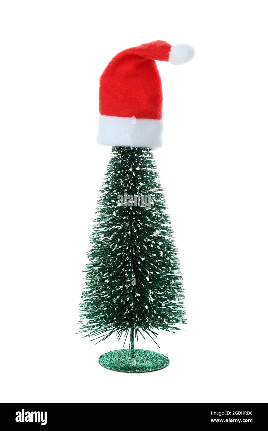 Christmas tree with Santa hat isolated on white background Stock Photo ...