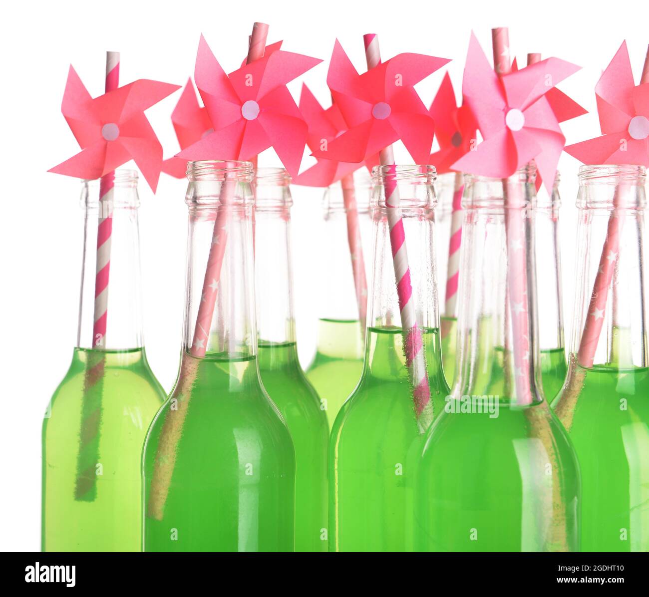 Bottles of drink with straw isolated on white Stock Photo - Alamy