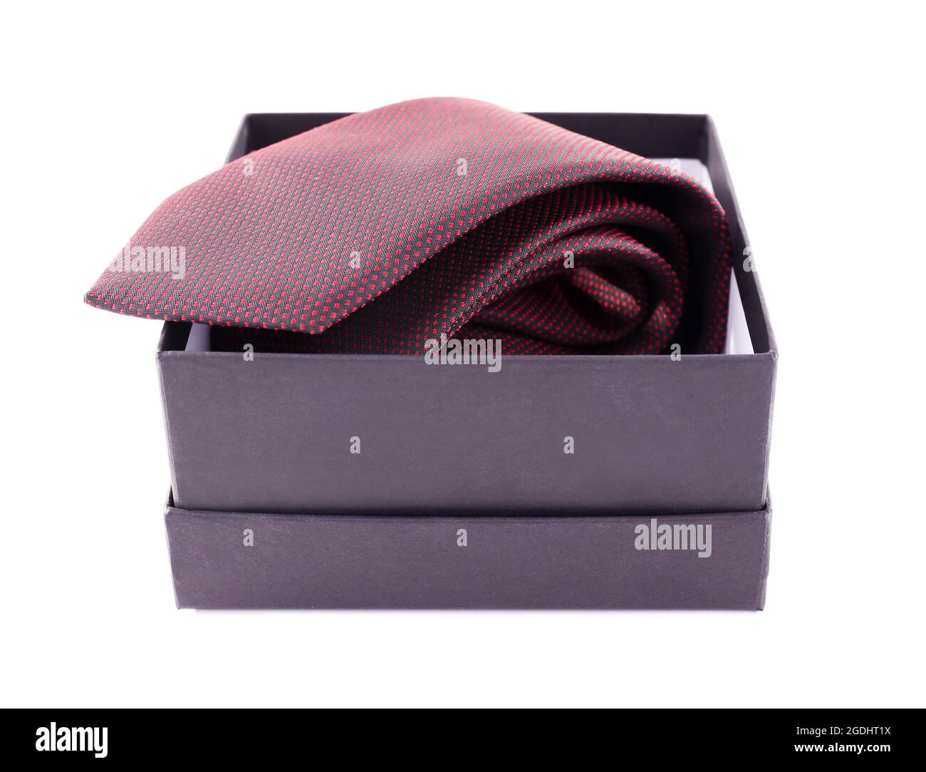 Brown tie in a square dark grey box on white background isolated Stock ...