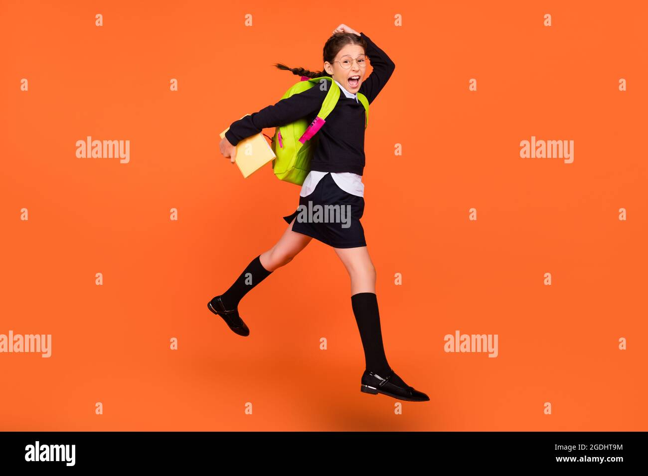 Full length body size view of pretty cheerful schoolgirl nerd jumping ...